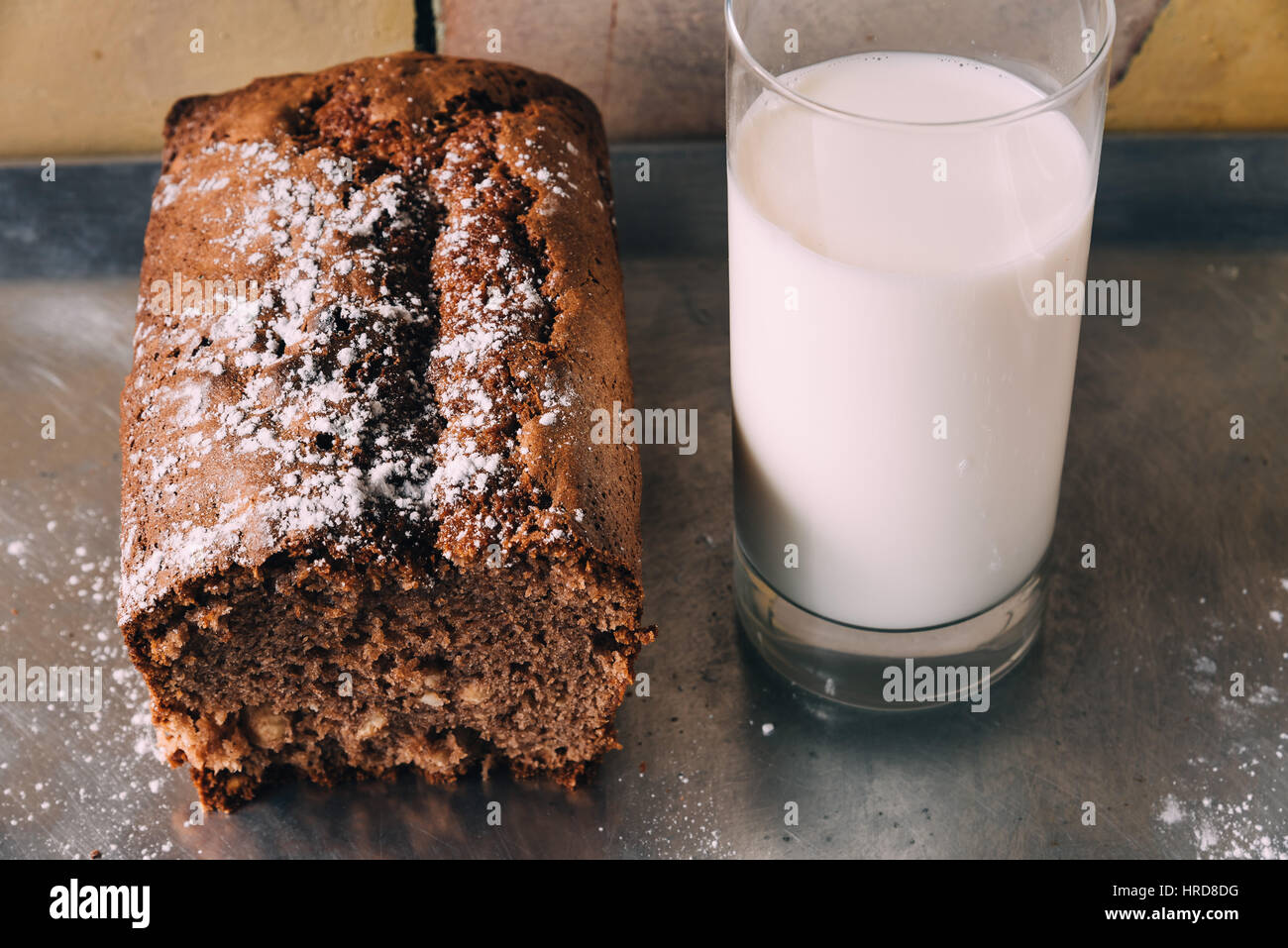 Chocolate cake with a glass of milk on baking tray Stock Photo - Alamy