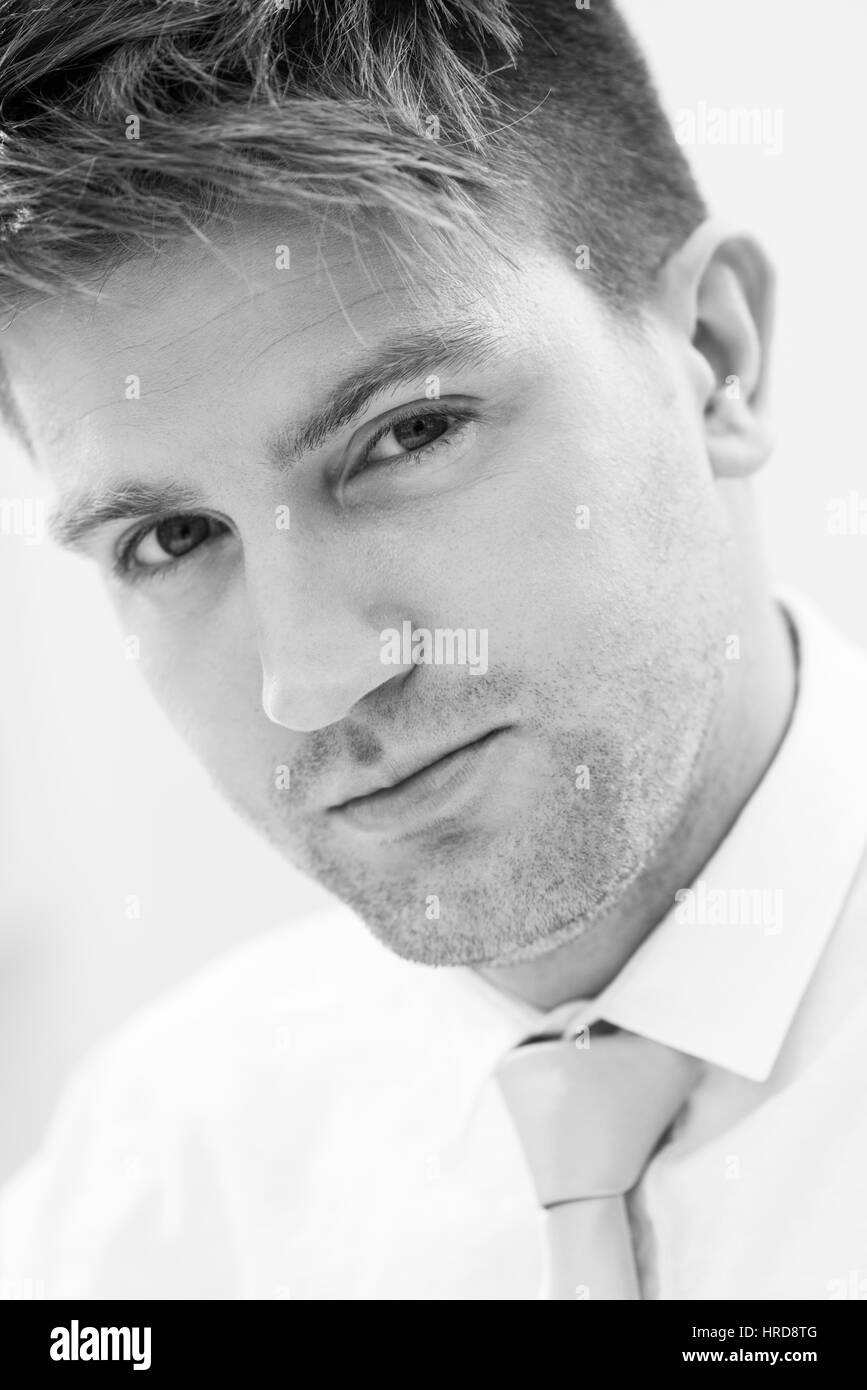 Portrait of a young handsome man in a representative strict clothing ...