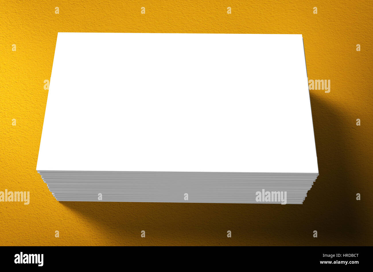 stack of blank name cards on yellow background Stock Photo - Alamy