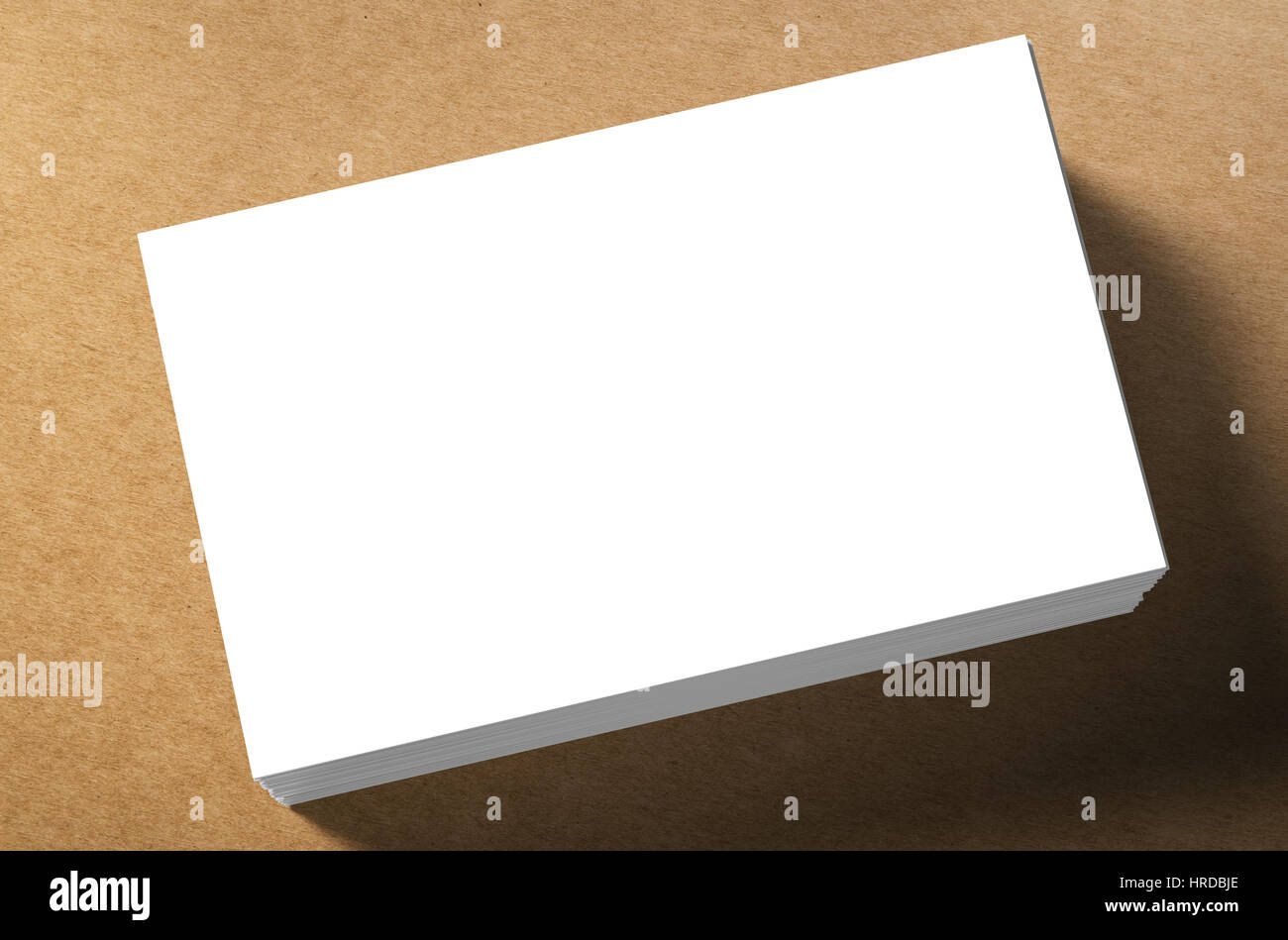 stack of blank name cards on brown background Stock Photo - Alamy