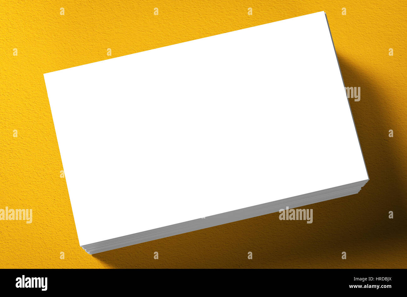 stack of blank name cards on yellow background Stock Photo - Alamy