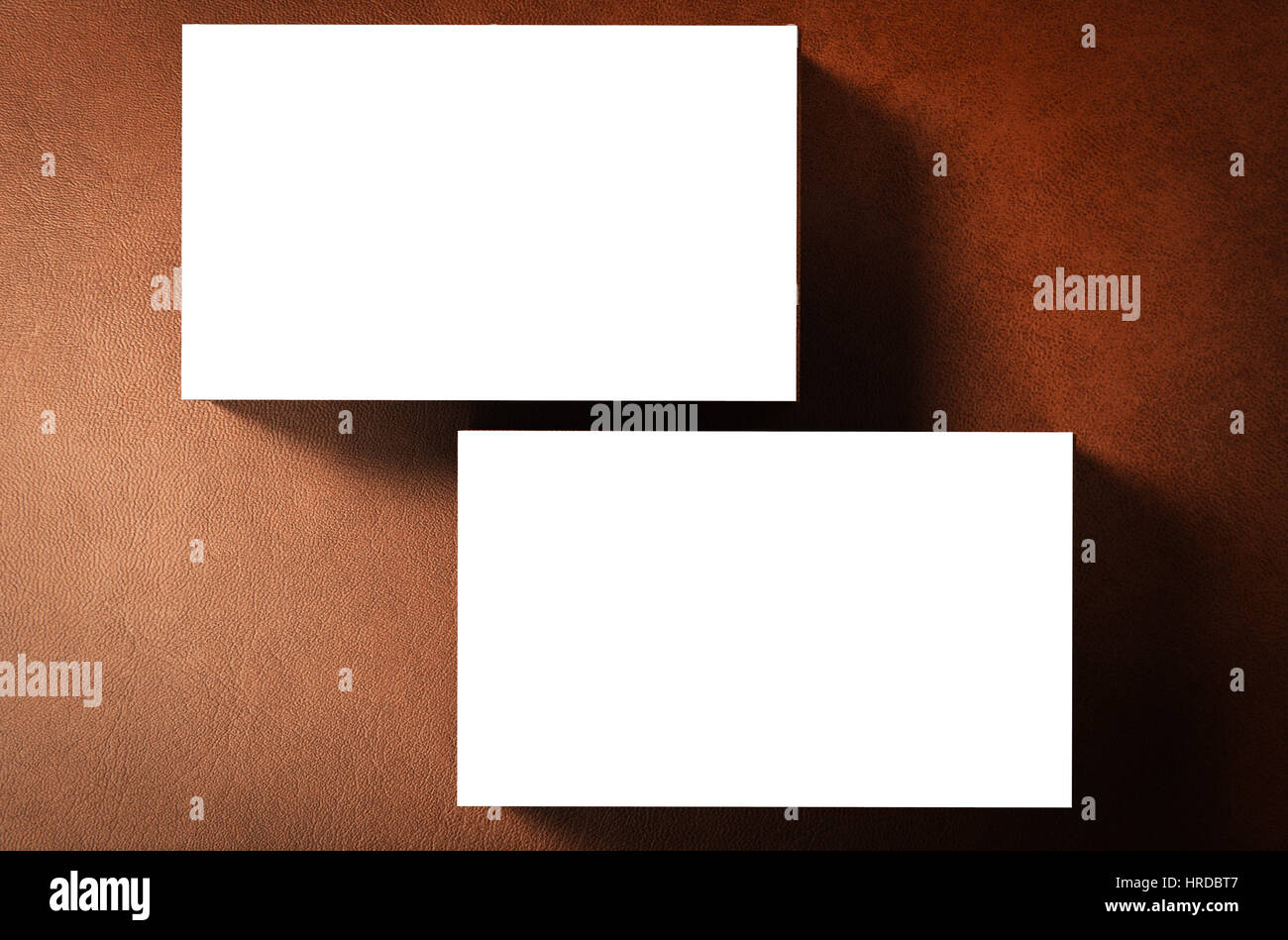 stack of blank name cards on brown background Stock Photo - Alamy