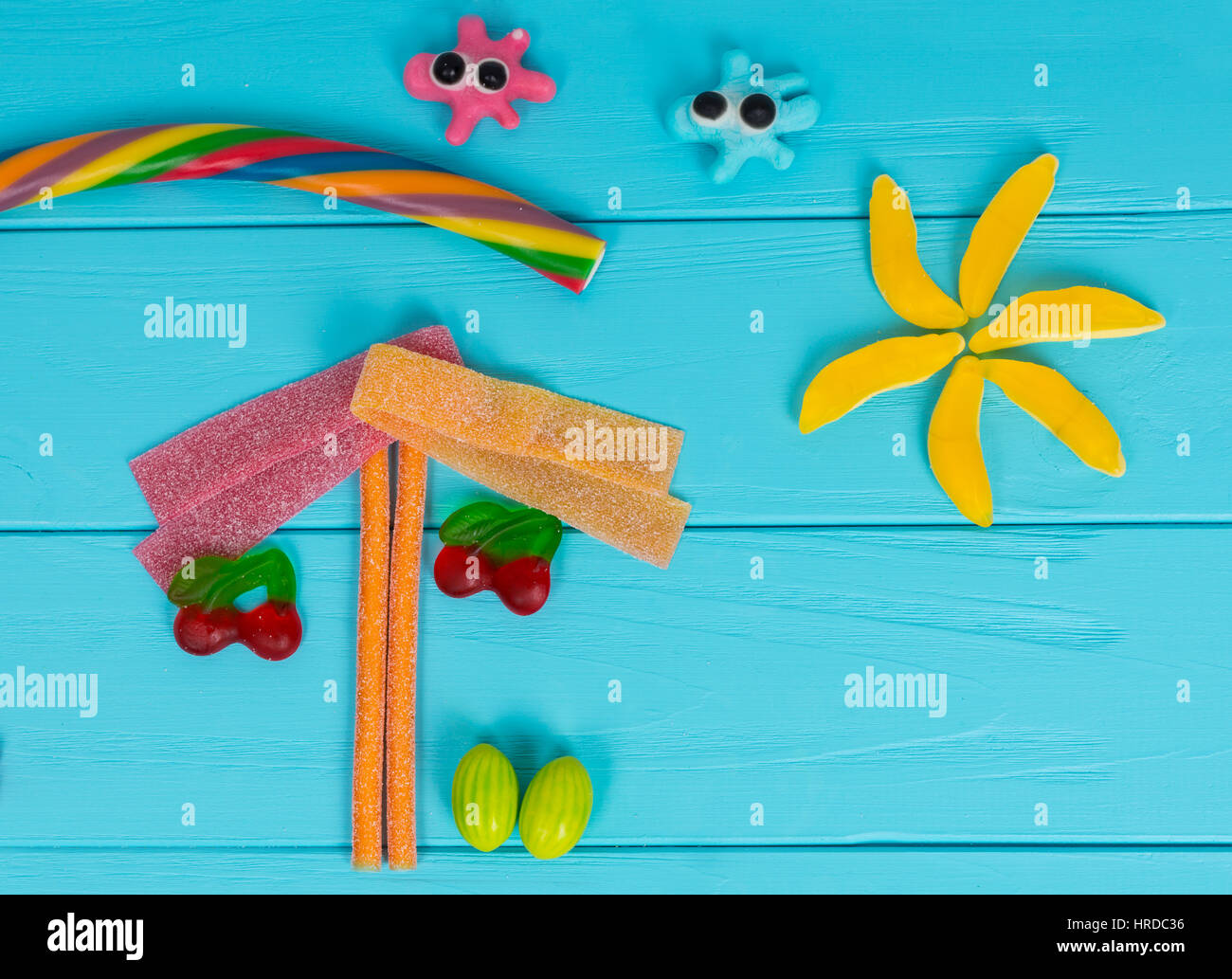 Funny picture of tasty jelly candies in the shape of cherries and trees ...