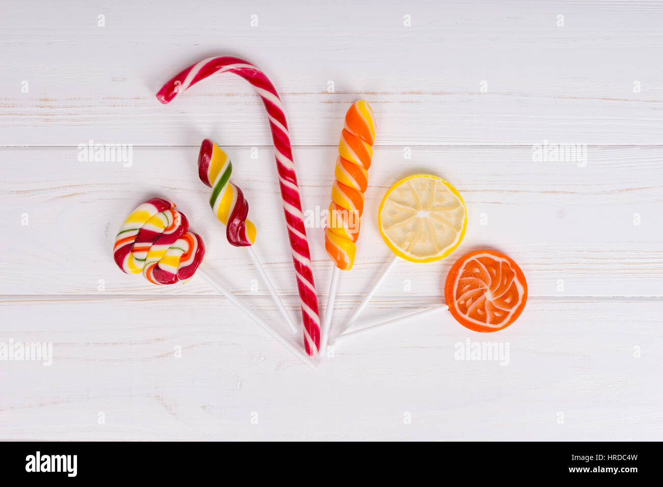Candy cane and colorful bright different lollipops as orange and lemon ...