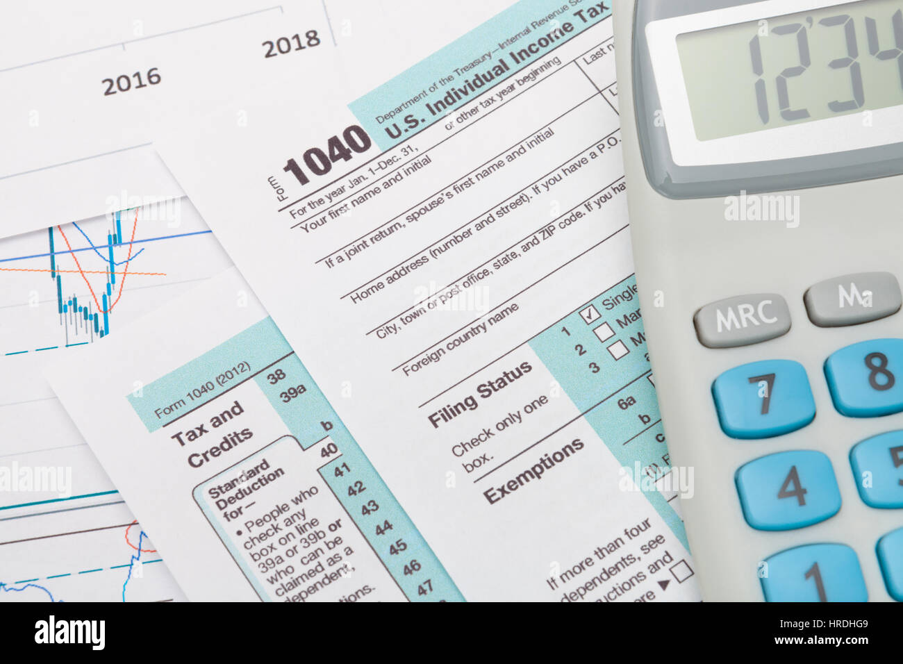 US 1040 Tax Form with calculator over it Stock Photo - Alamy