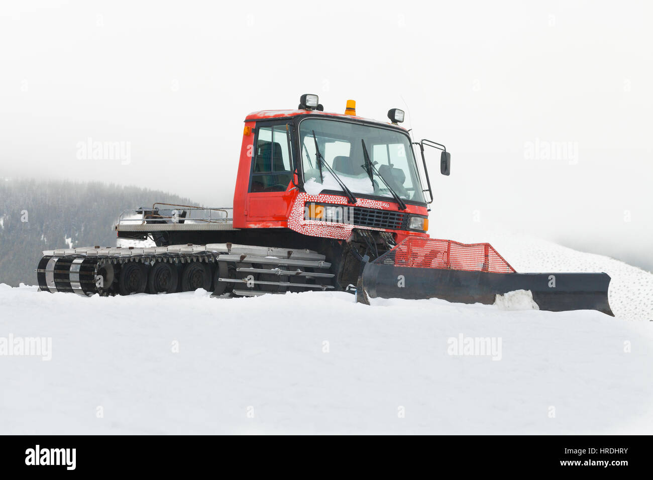 Ratrack preparing a slope for riding Stock Photo - Alamy