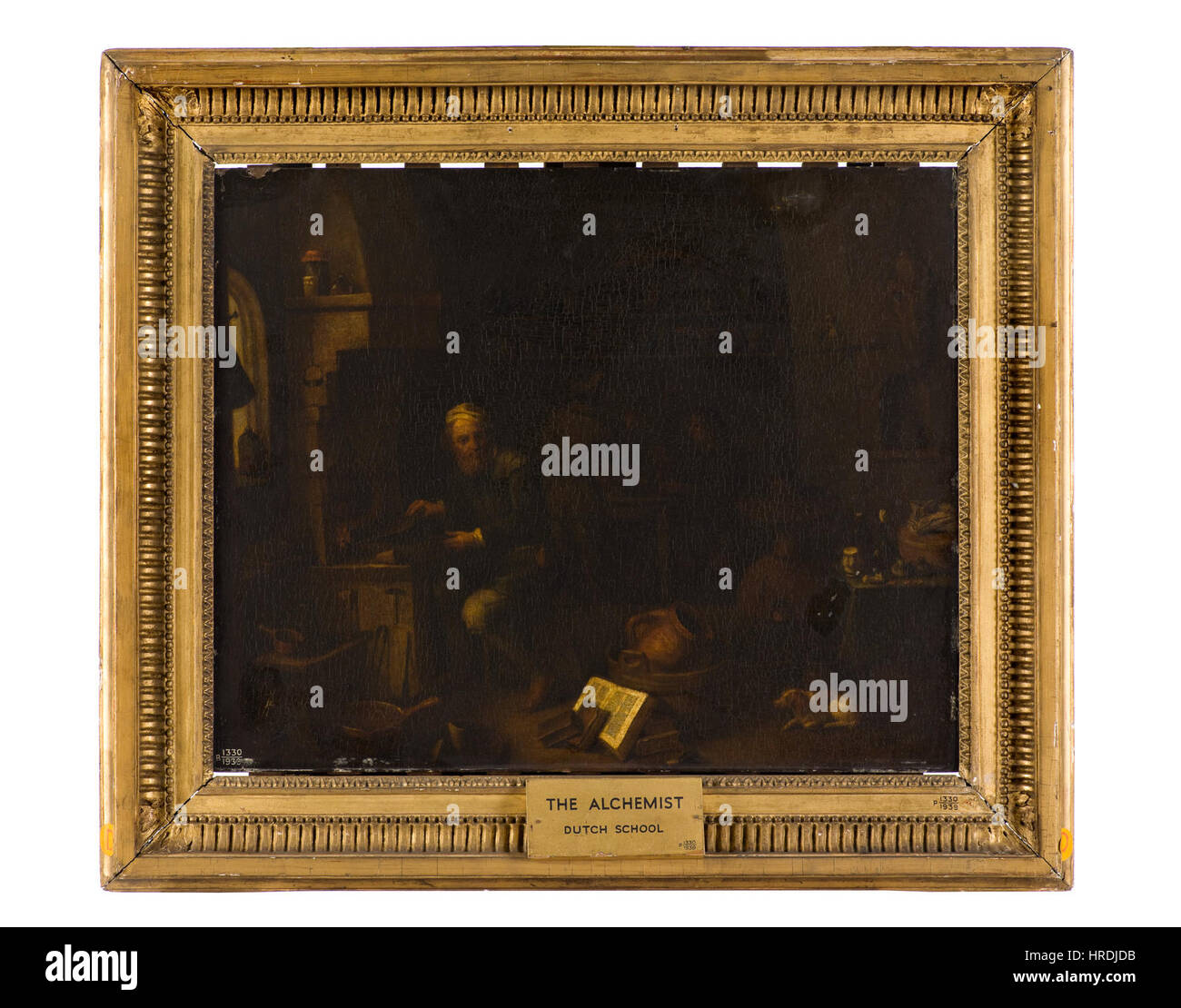 This framed image titled 'An Alchemist' depicts a traditional depiction ...