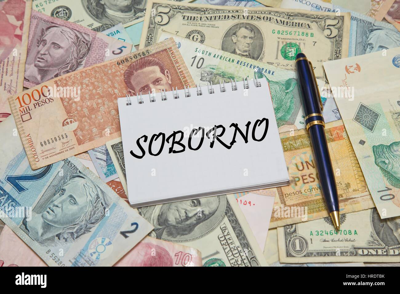 Notebook page with SPANISH text "SOBORNO" (BRIBE), background from ...
