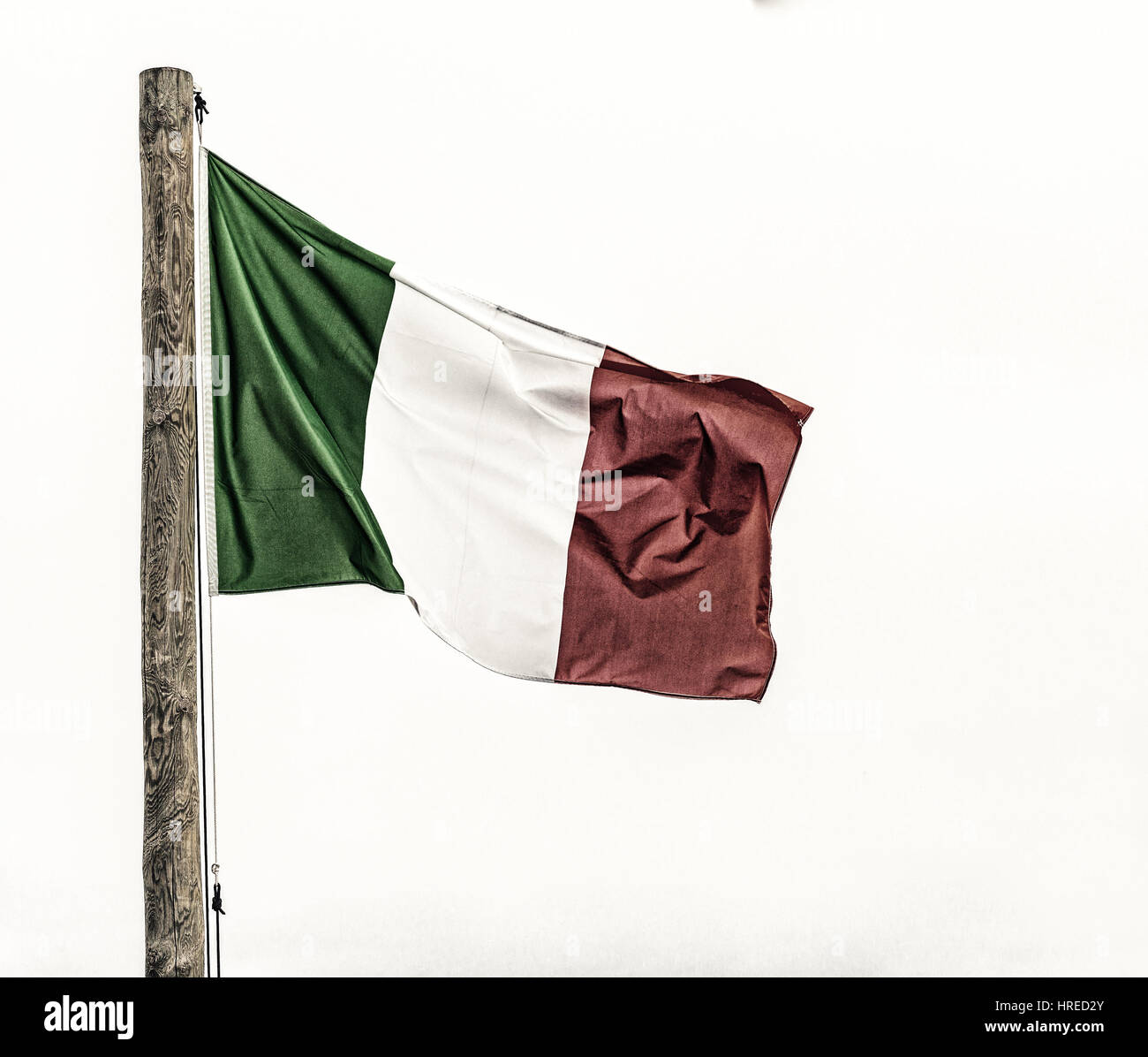 Italian flag waving on wooden pole Stock Photo - Alamy