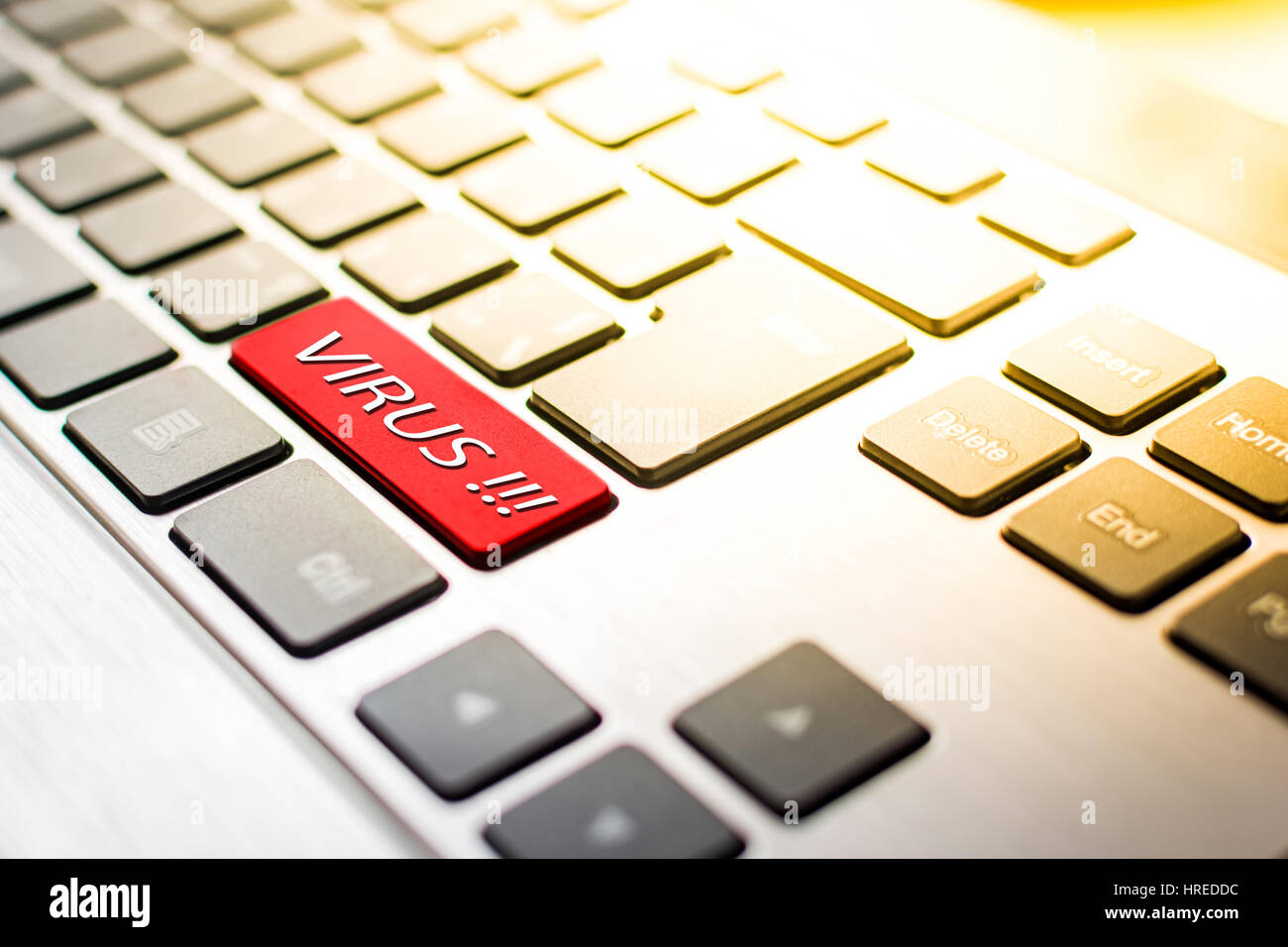 Keyboard of computer or laptop with red sign virus Stock Photo - Alamy