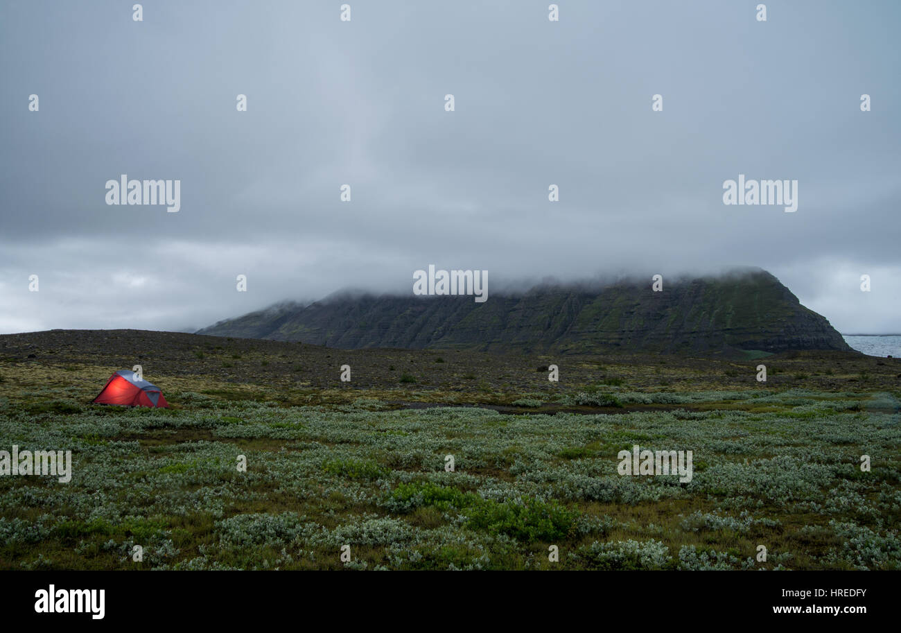 Red tent in scenic green landscape of Iceland Stock Photo - Alamy