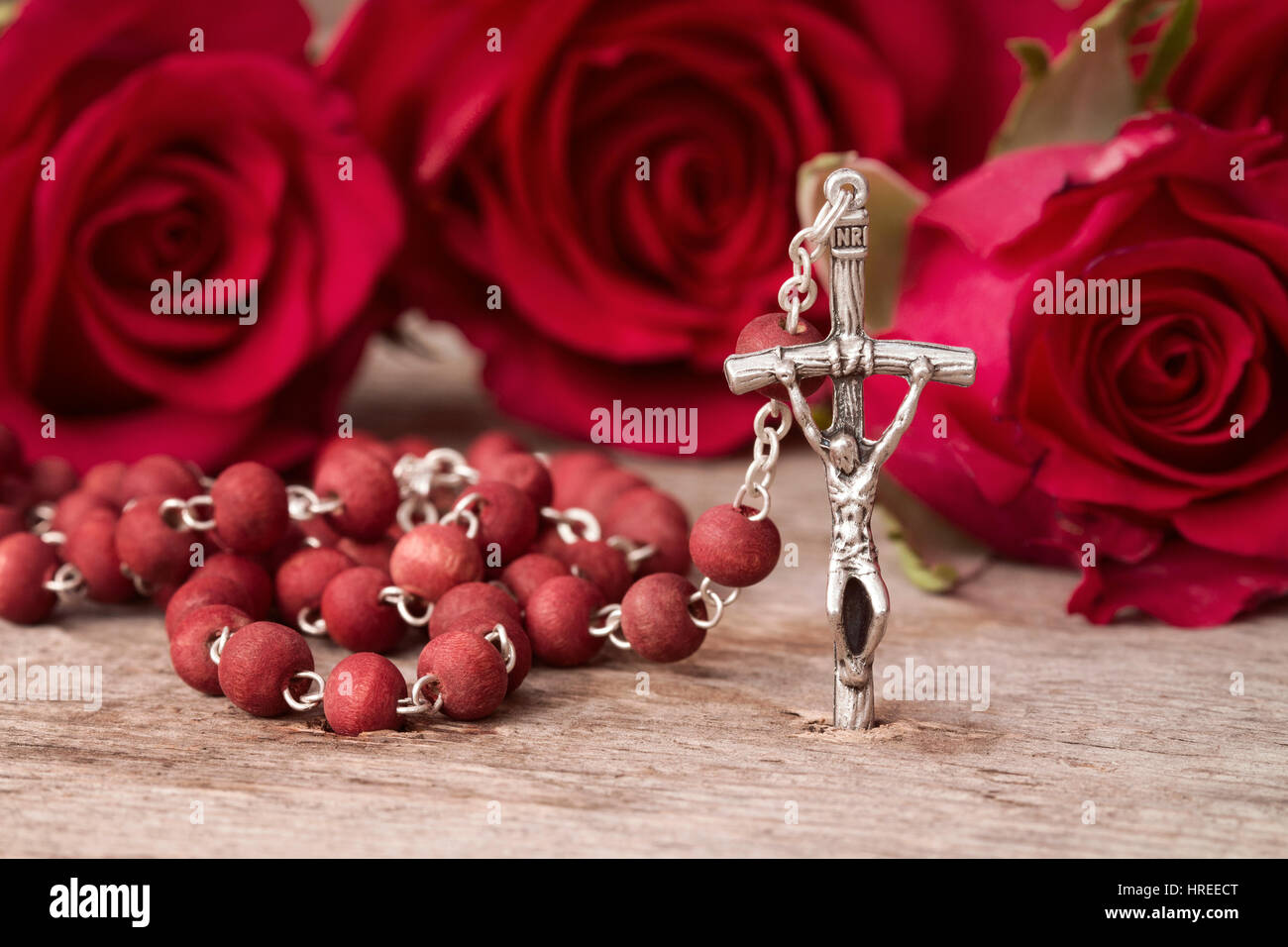 Cross crucifix rose roses hi-res stock photography and images - Alamy