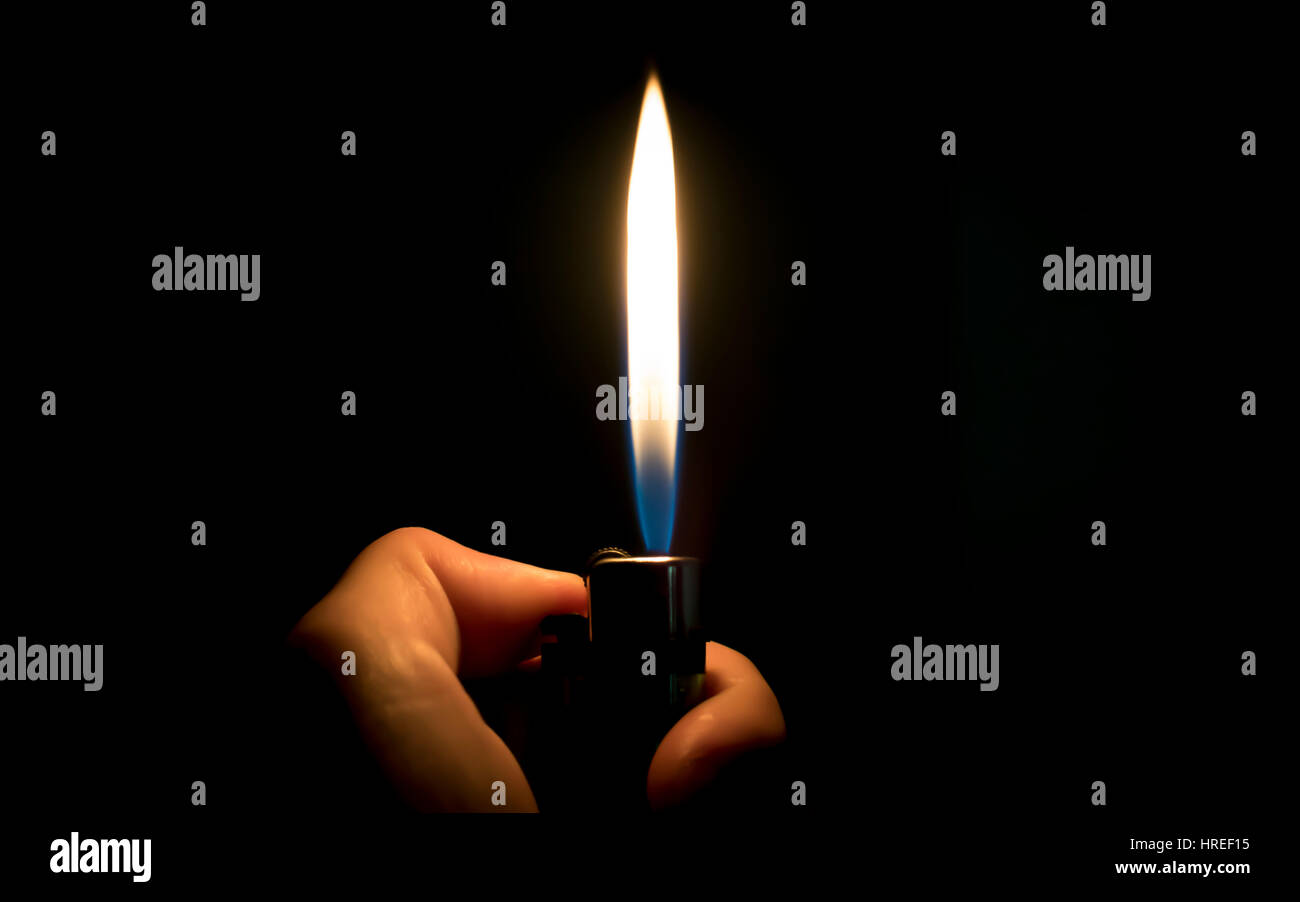 Lighter on the hand Stock Photo - Alamy
