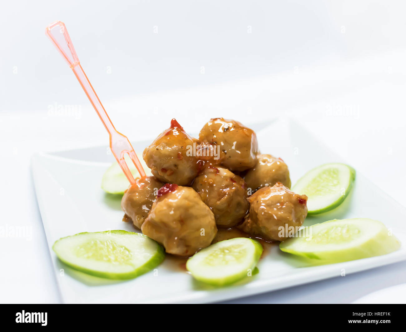 Pork balls with cucumber Stock Photo - Alamy