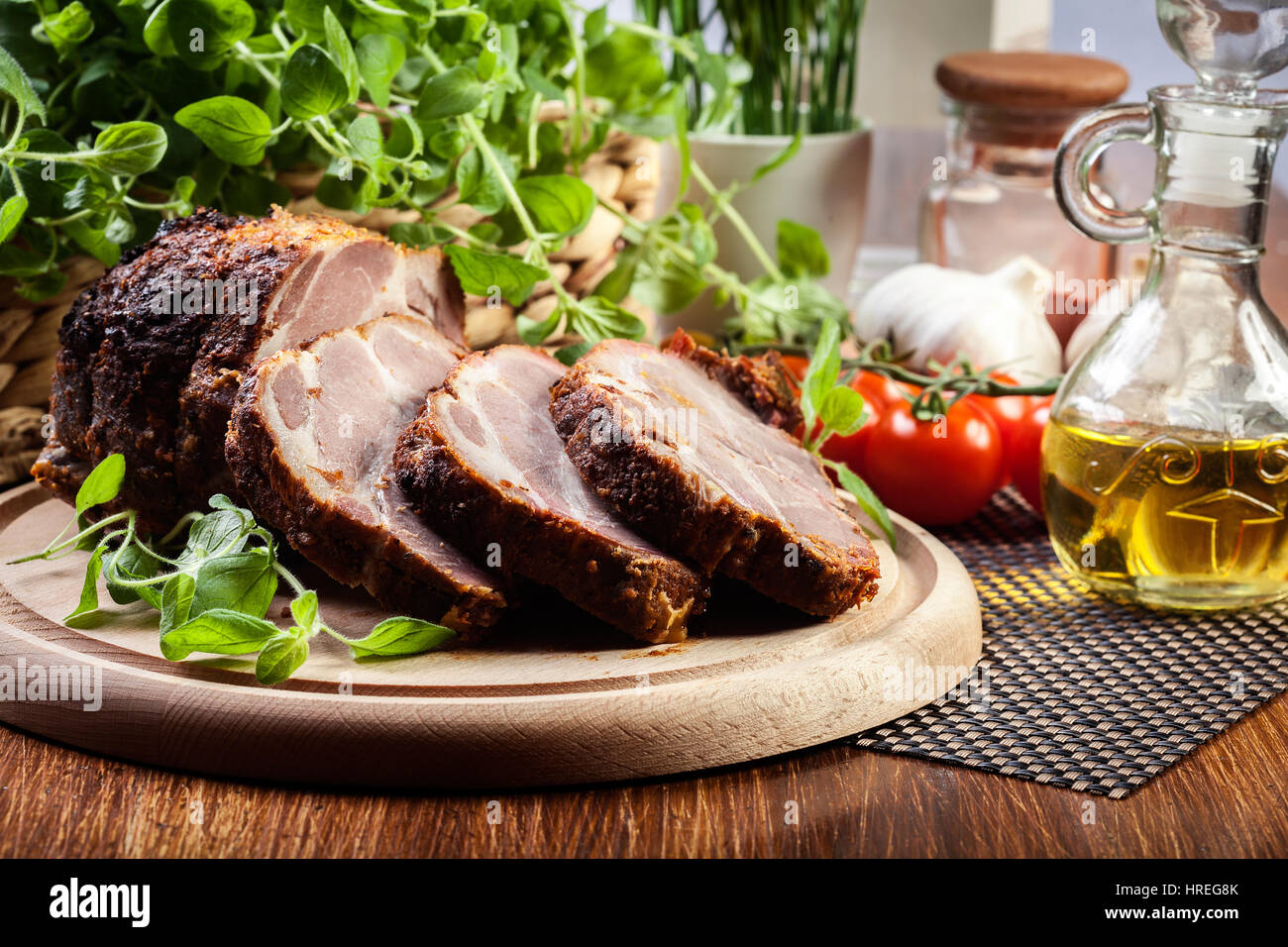 Roasted pork neck with spices on cutting board Stock Photo - Alamy