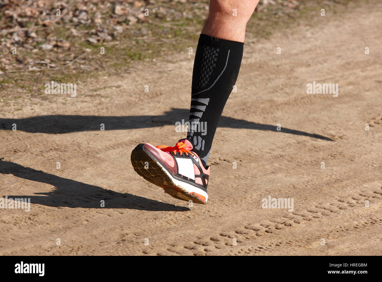 Senior athletic runner leg detail. Outdoor circuit. Horizontal Stock ...