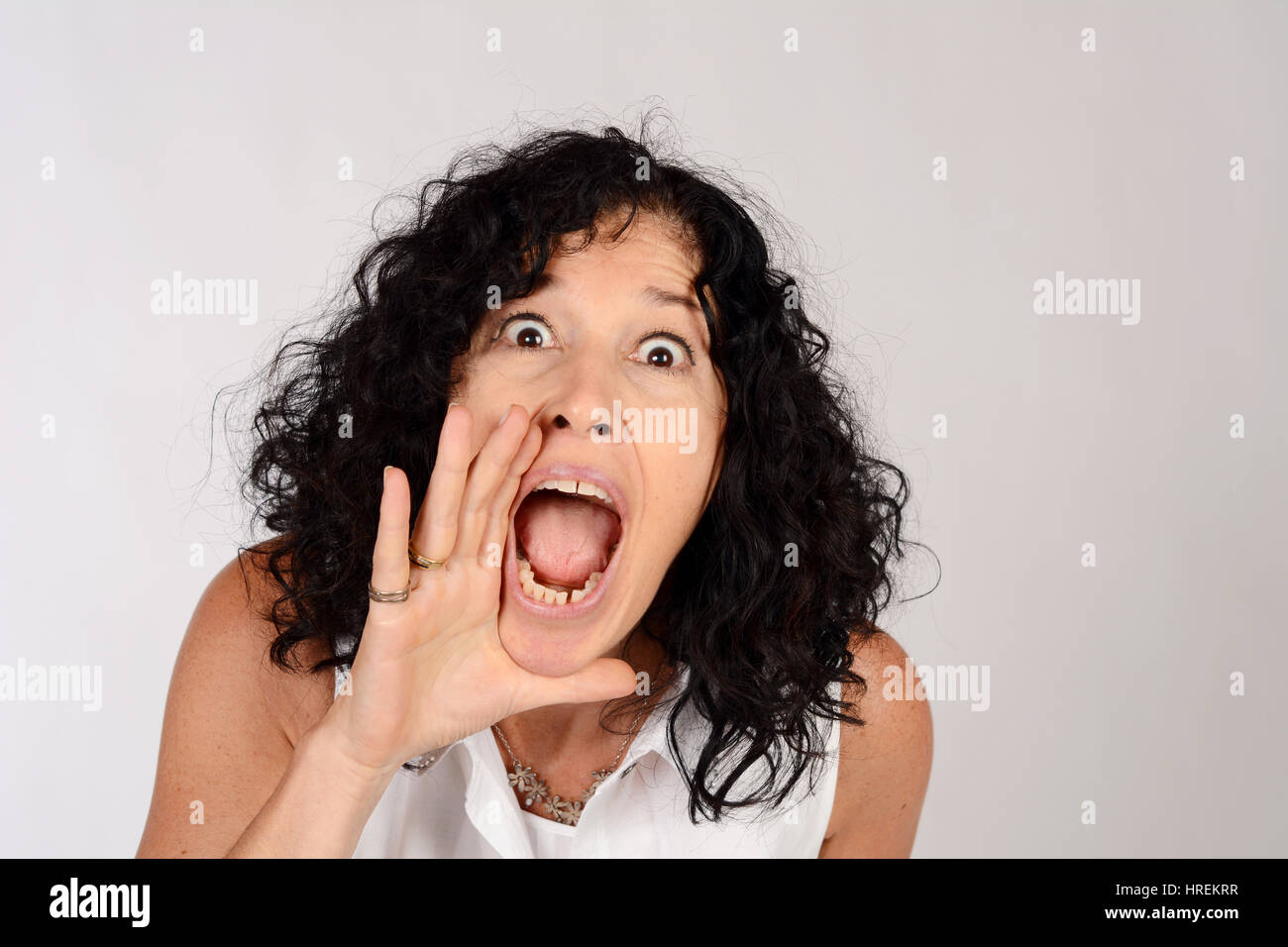 Beautiful woman shouting and screaming. Isolated white background Stock ...