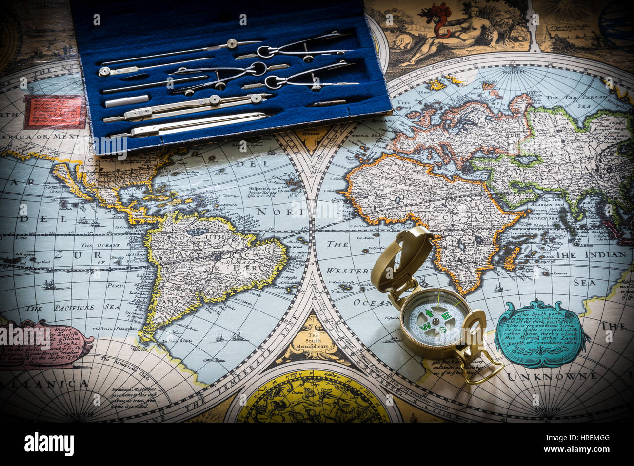 compass and antique drafting instruments on ancient world map Stock ...