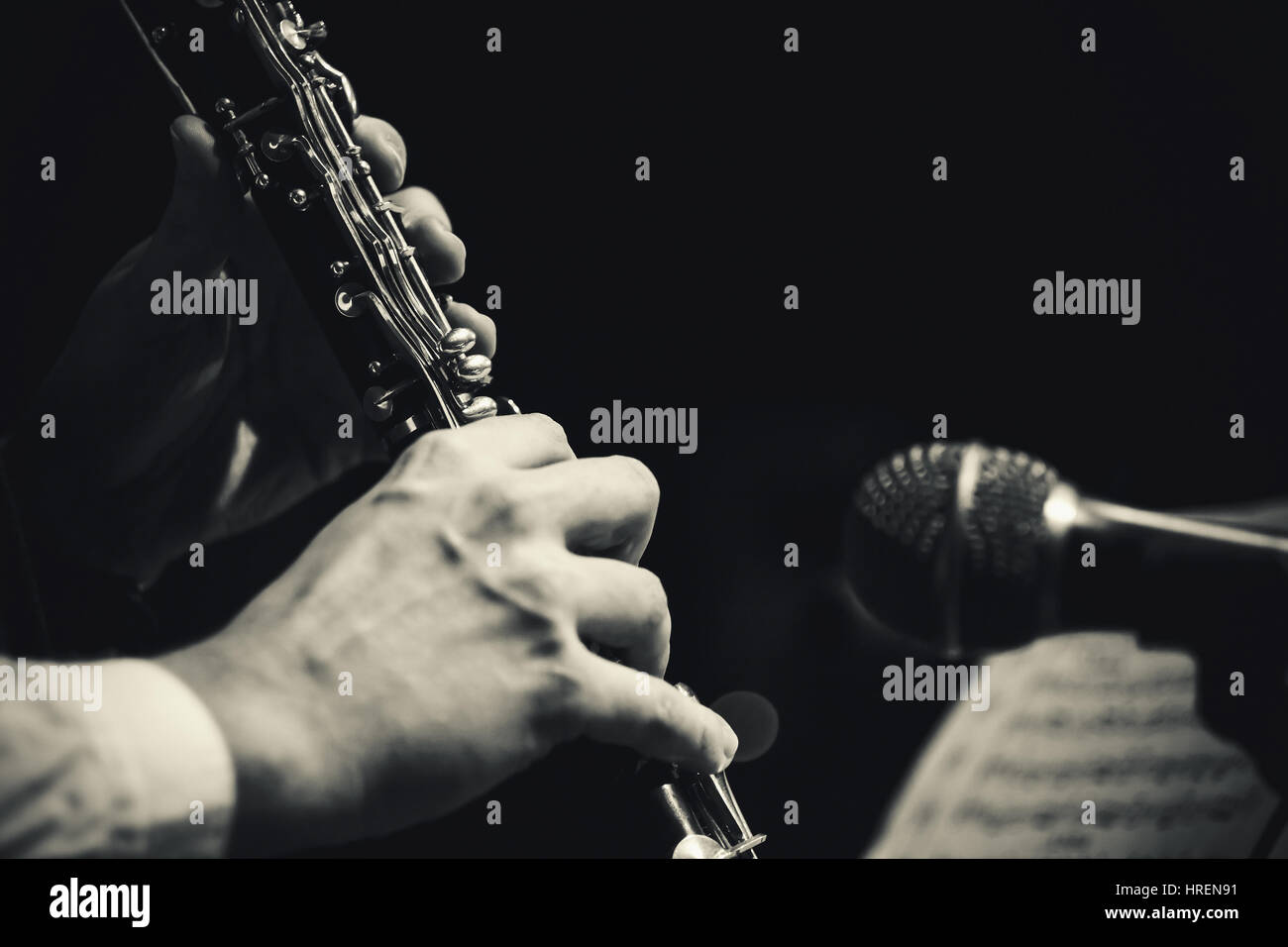 Playing clarinet in front of microphone, in black and white Stock Photo ...