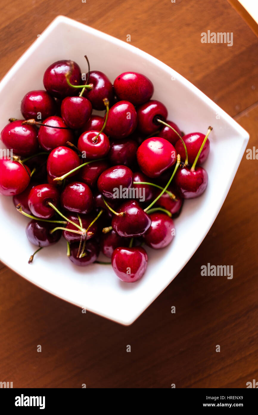 cherries in a white square plate Stock Photo - Alamy