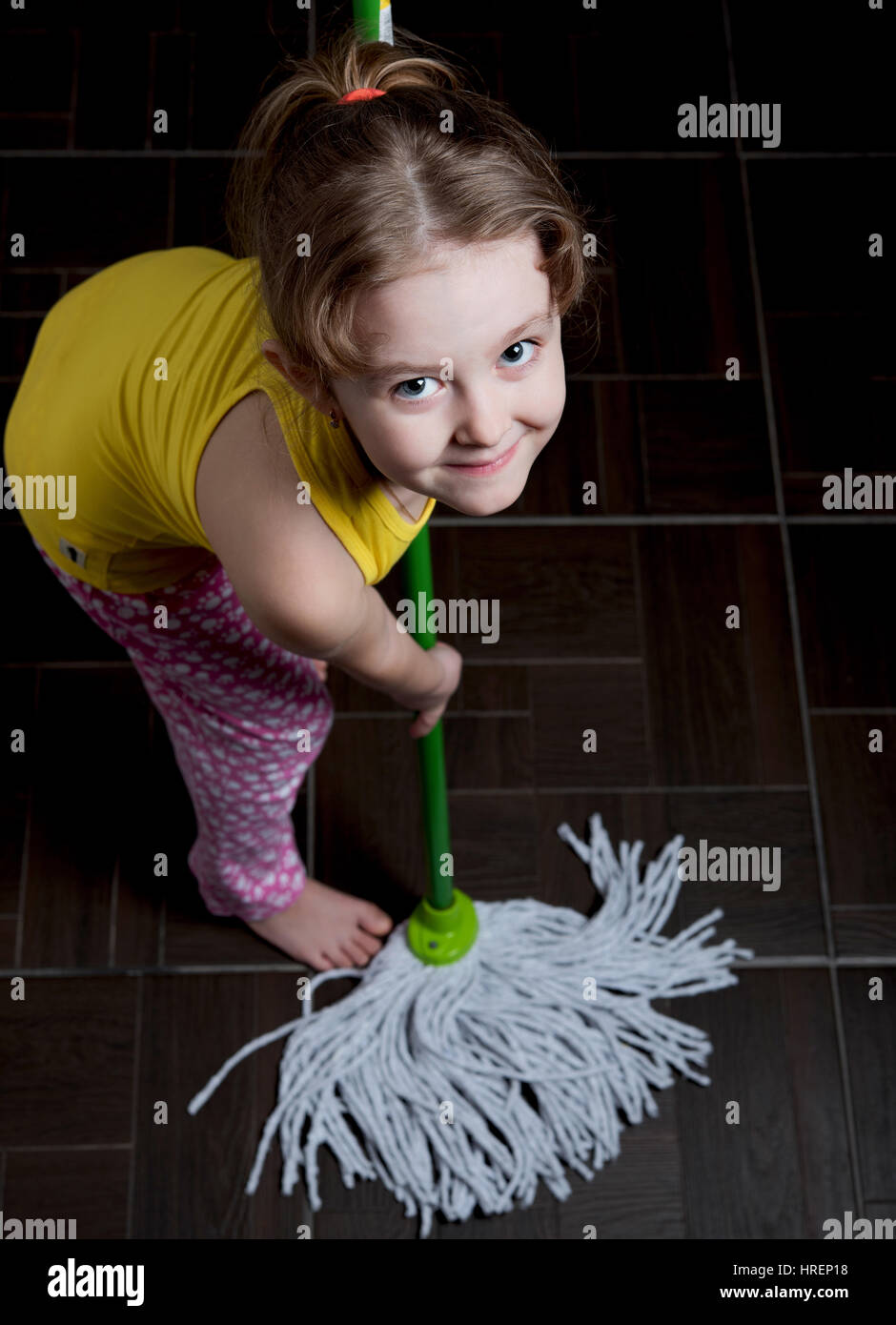 child washing the floor with MOP Stock Photo - Alamy