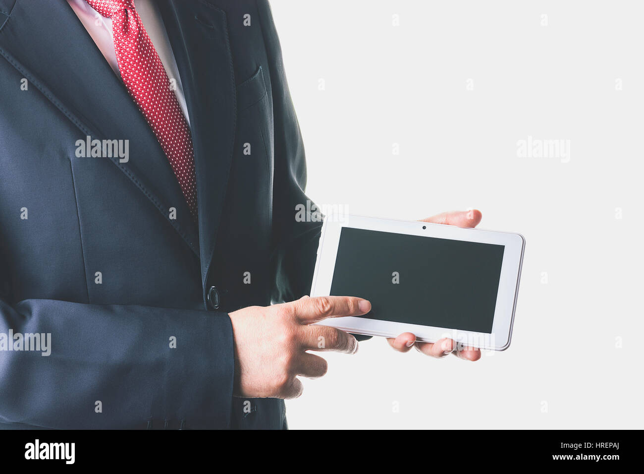 Businessman using tablet Stock Photo - Alamy