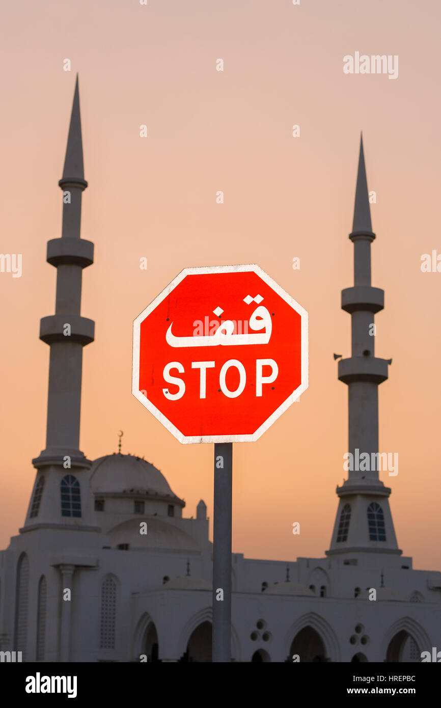 FUJAIRAH, UNITED ARAB EMIRATES - Bilingual stop sign and mosque Stock ...
