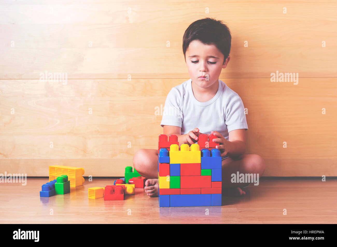 Boy playing with blocks hi-res stock photography and images - Alamy
