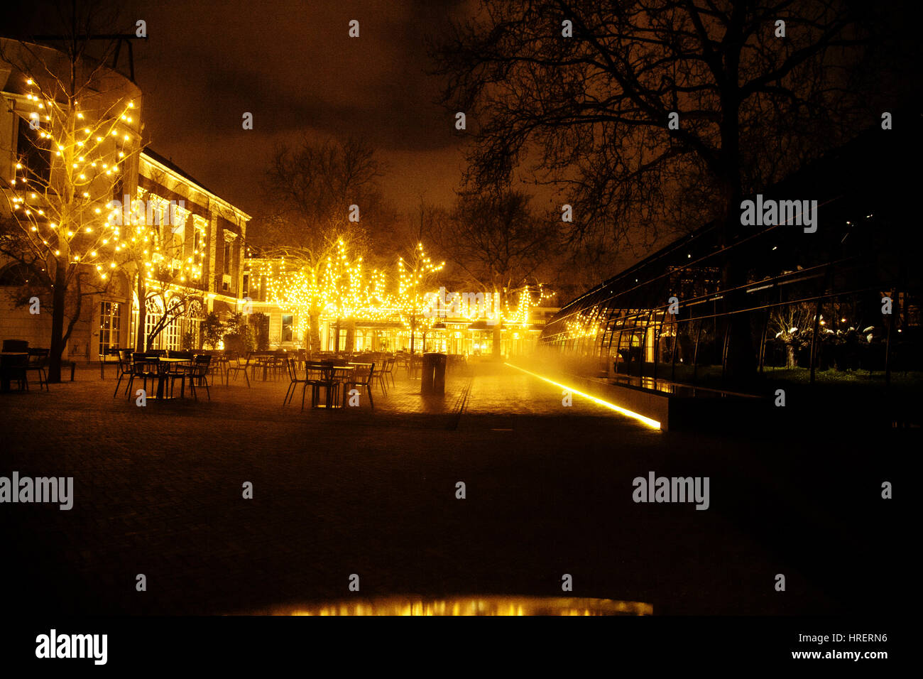 empty night restaurant, lot of tables and chairs with noone, magic ...