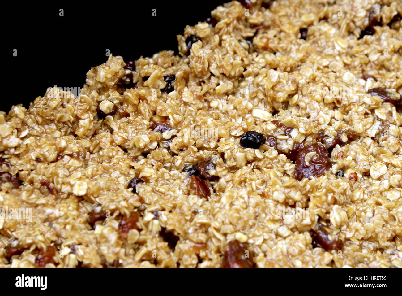 Fruit flapjack mix ready to bake in the oven Stock Photo - Alamy
