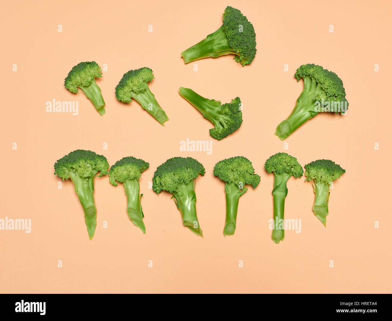 The fresh broccolis on the pink background Stock Photo - Alamy