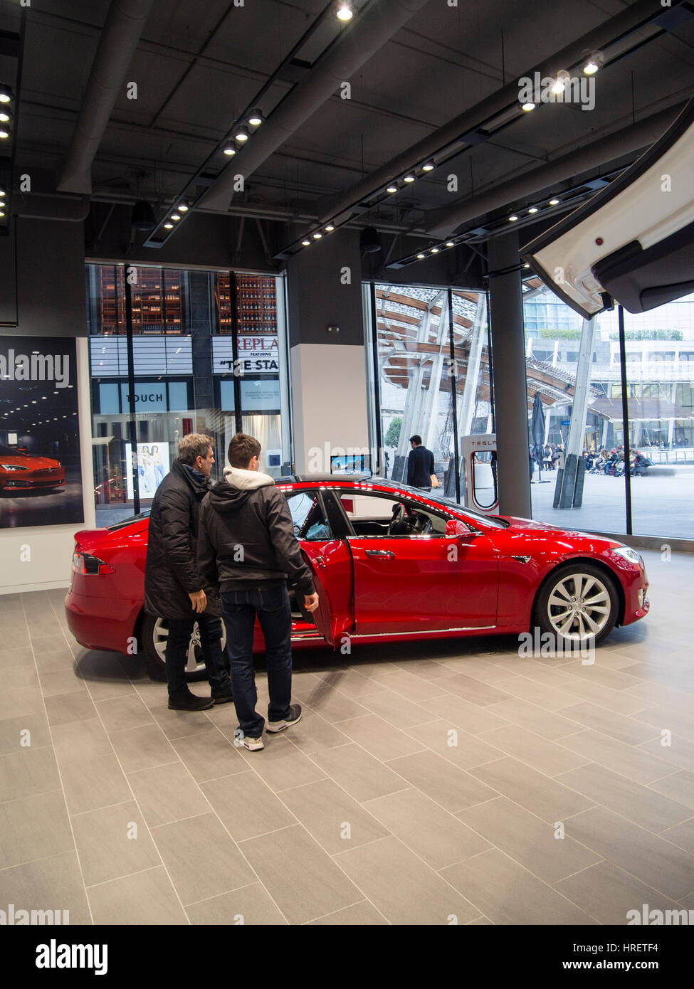Tesla showroom , Milan Italy Stock Photo - Alamy
