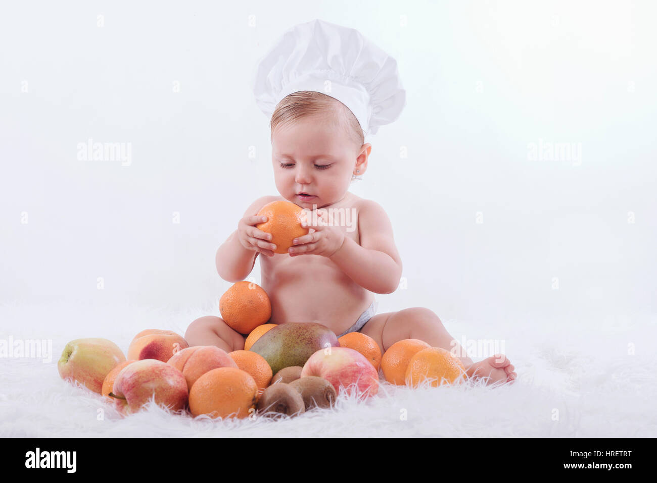 Baby girl in chef hat hi-res stock photography and images - Alamy