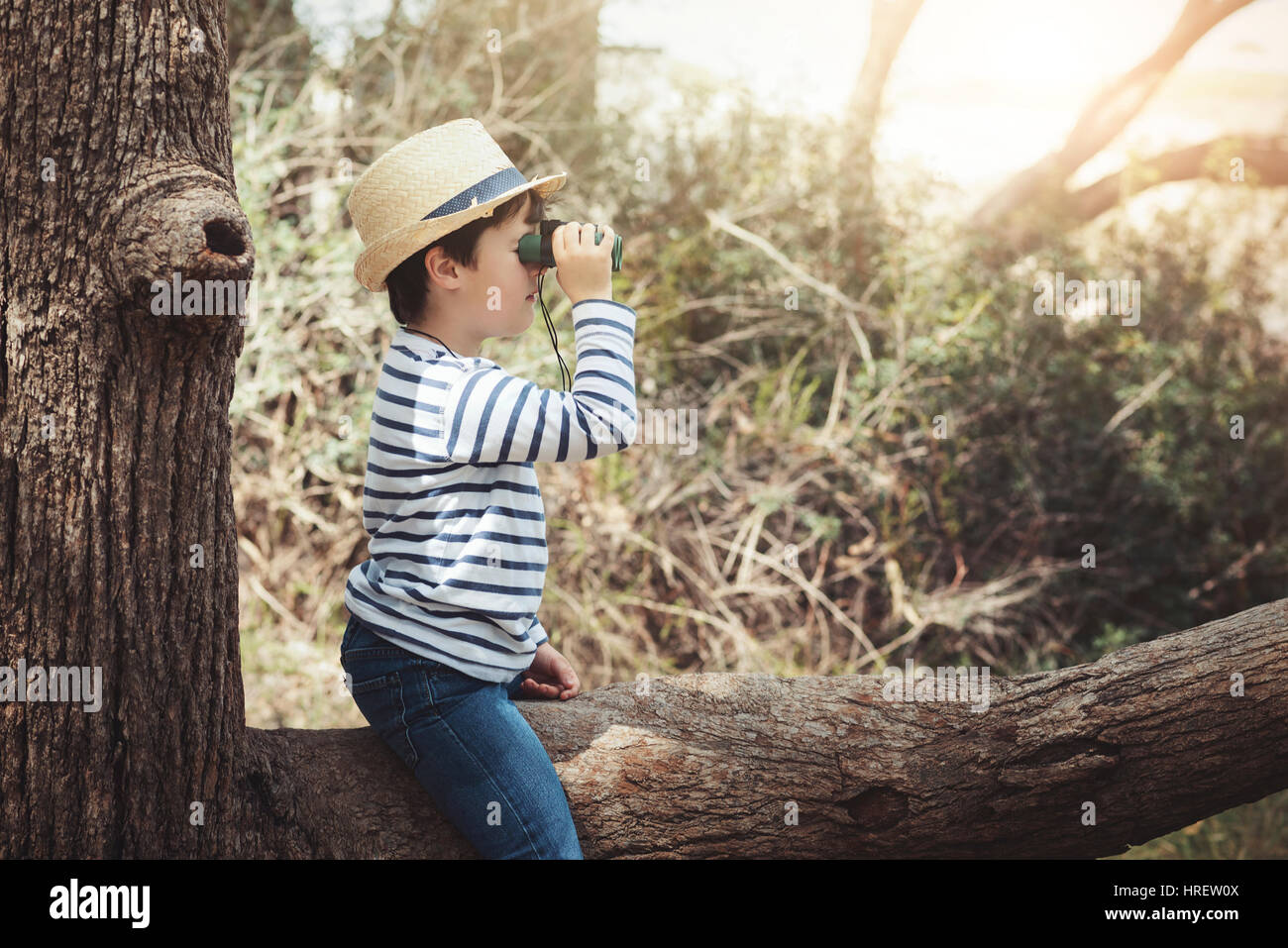 boy exploring the outdoors with binoculars Stock Photo - Alamy