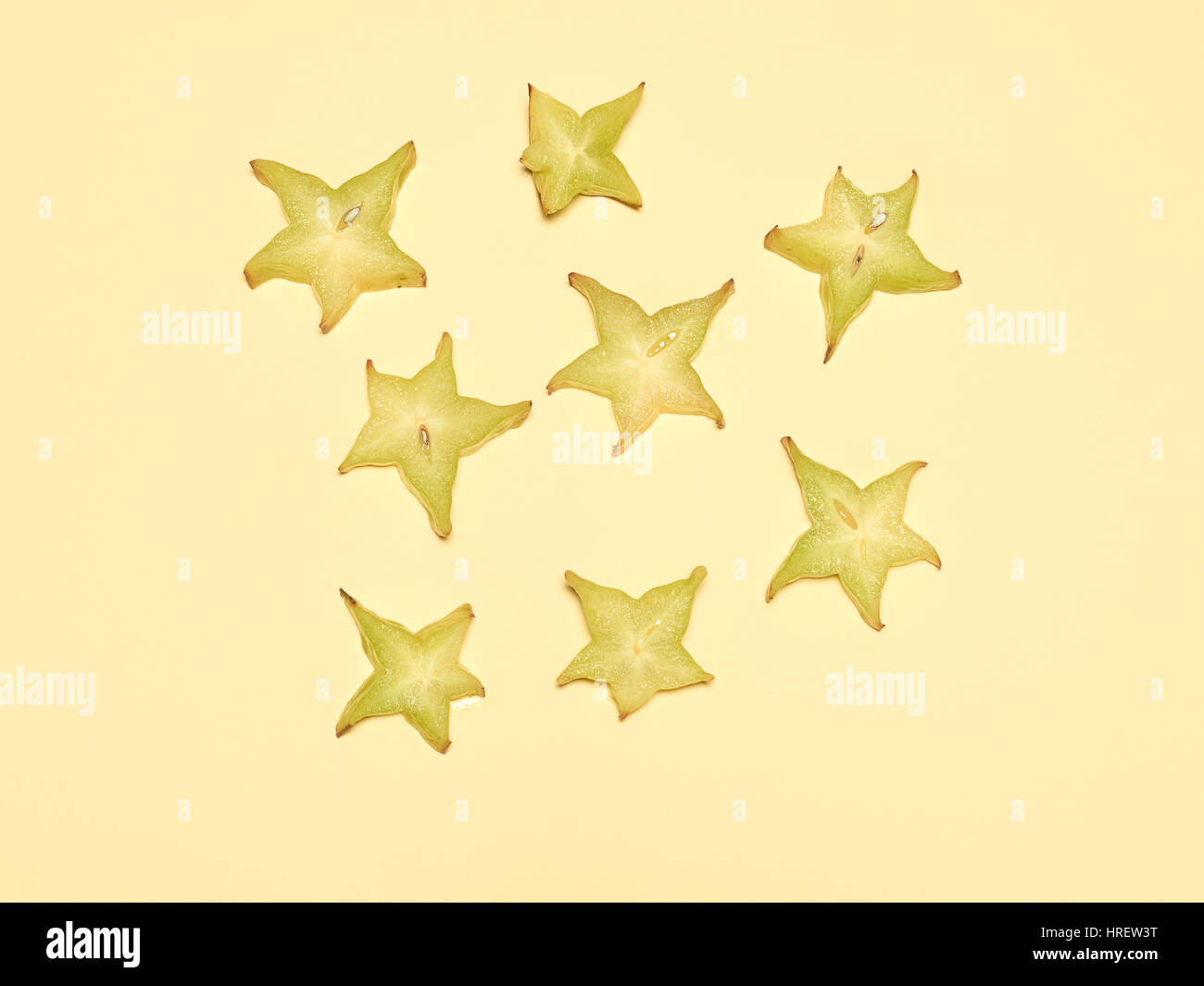 Stacked slices of star fruit or karambole on a yellow background Stock ...
