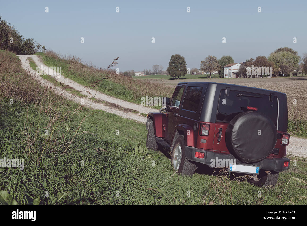 red jeep in the countryside on a beautiful day Stock Photo - Alamy