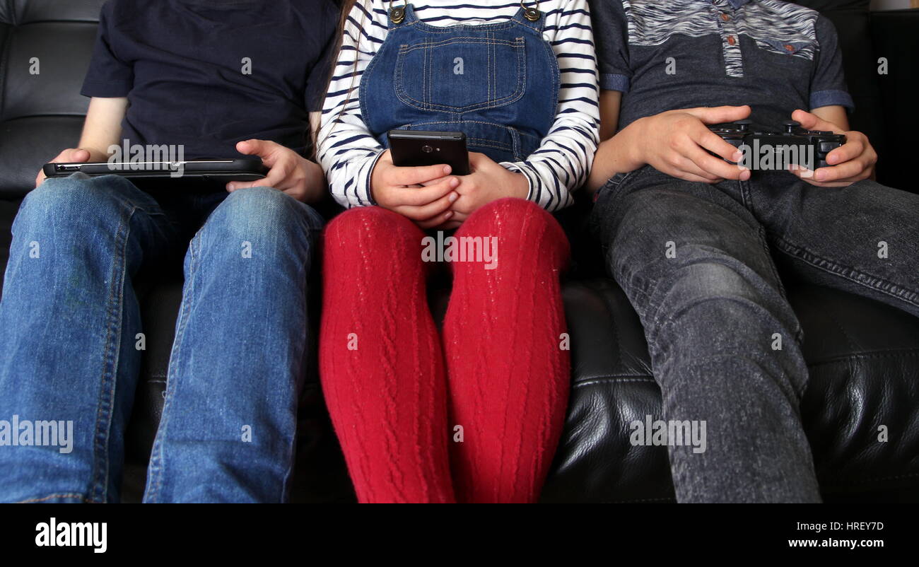 Children playing electronic games hi-res stock photography and images ...