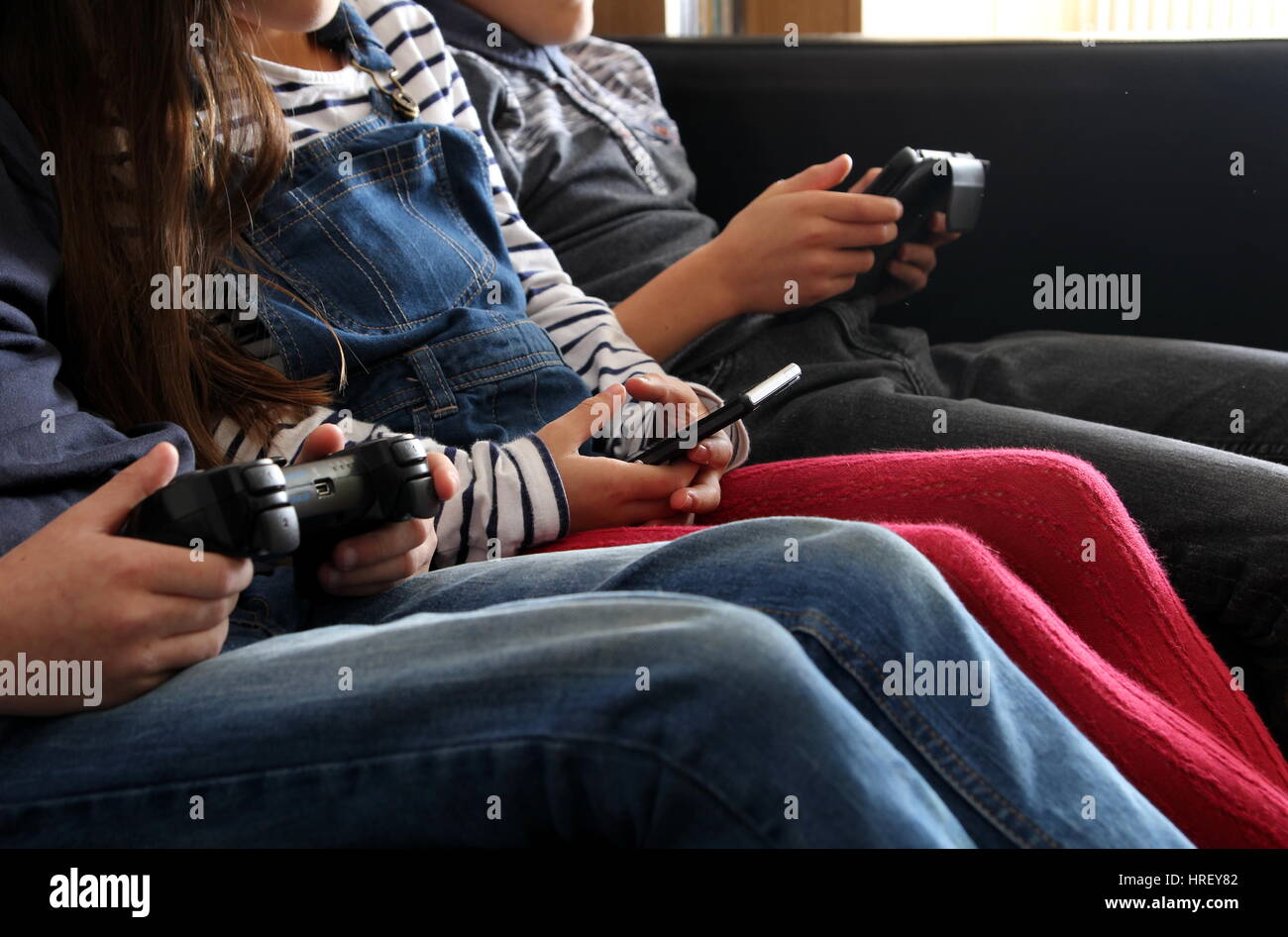 Children playing electronic games hi-res stock photography and images ...