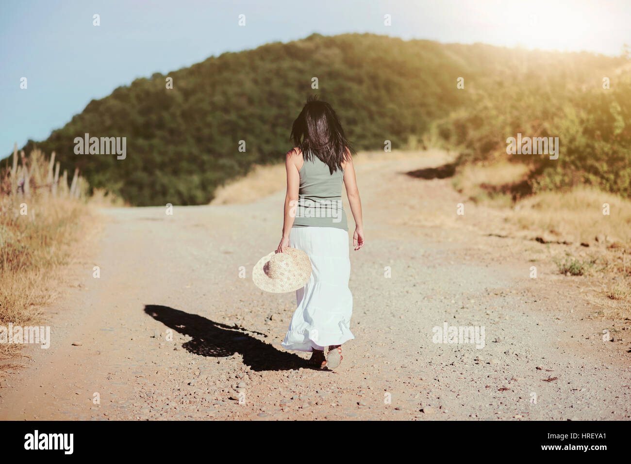 Back view of a woman walking hi-res stock photography and images - Alamy