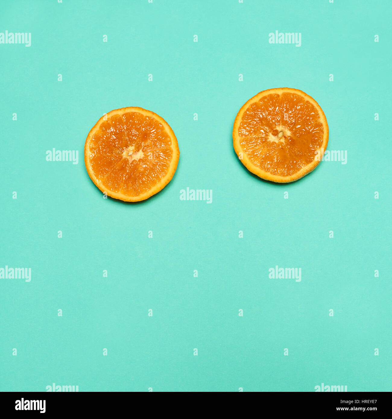 Ripe Mandarin fruits peeled open on the blue background Stock Photo - Alamy