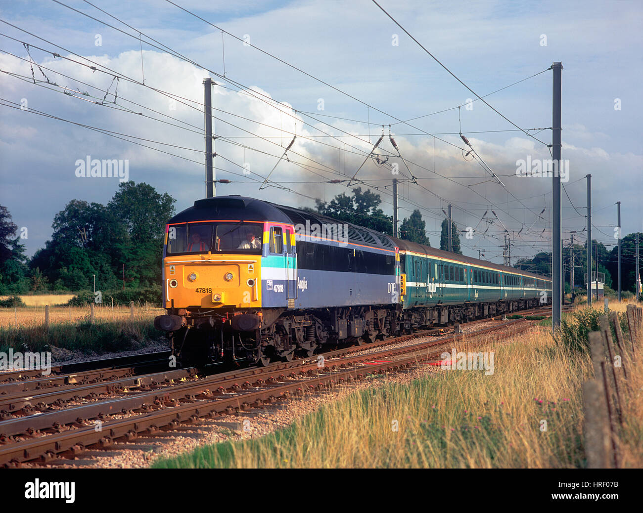 A class 47 locomotive working a diverted "One" Anglia service at Stock ...