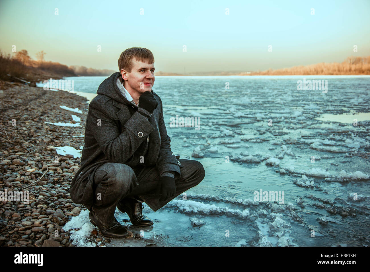 strong motivation. man crouched in a strong position. winter. on the ...