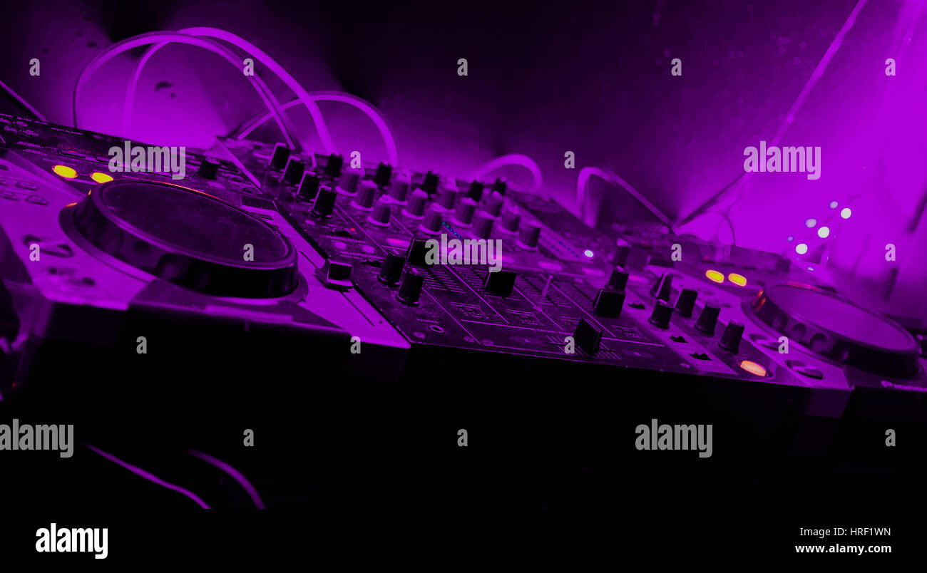 dj mixer with yellow tones and cyan lights , night club party Stock ...