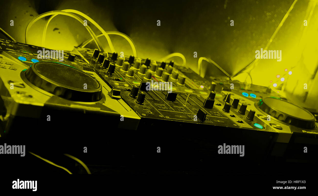 dj mixer with yellow tones and cyan lights , night club party Stock ...