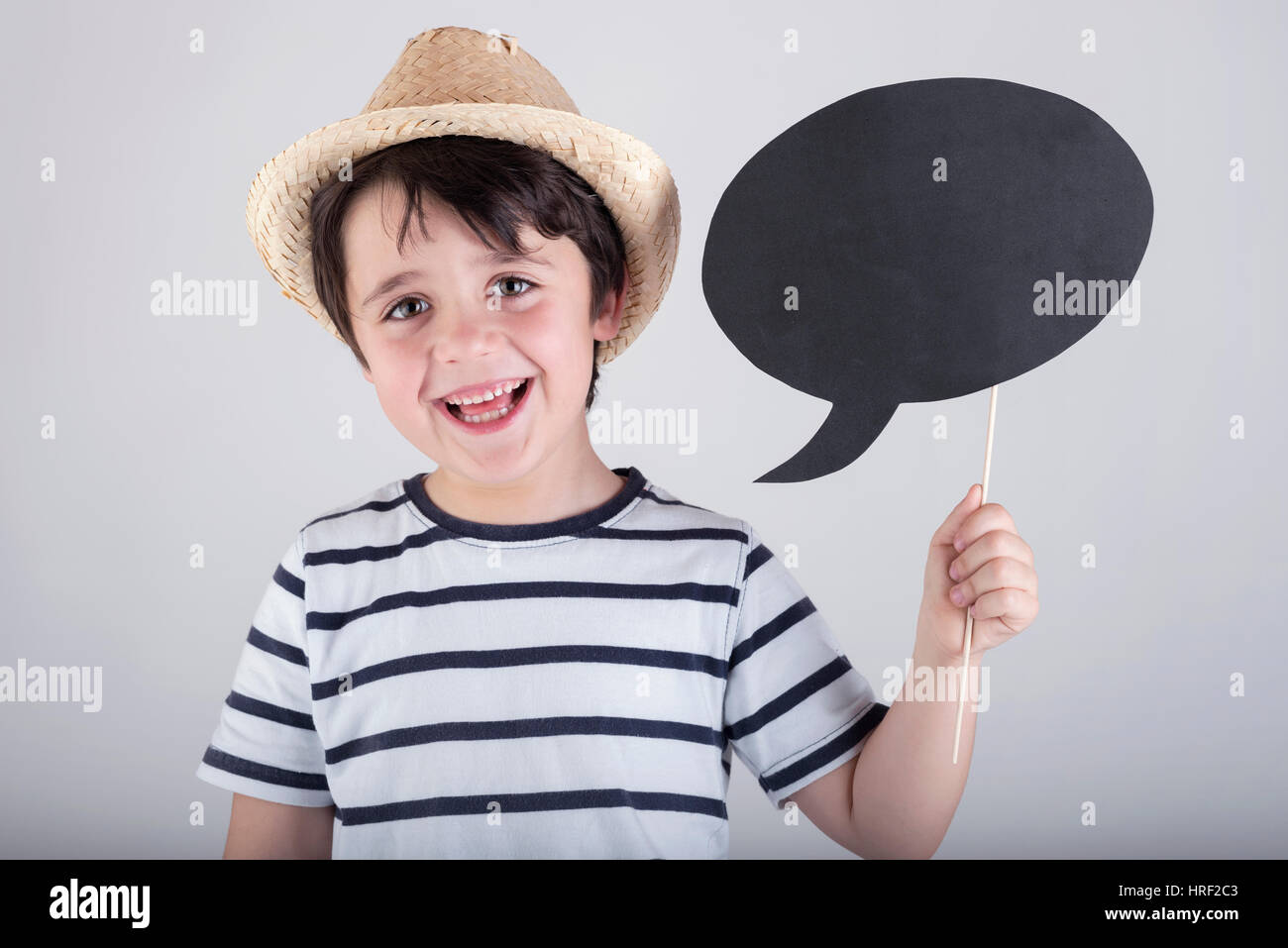 happy child. Portrait of happy boy holding sign Stock Photo - Alamy