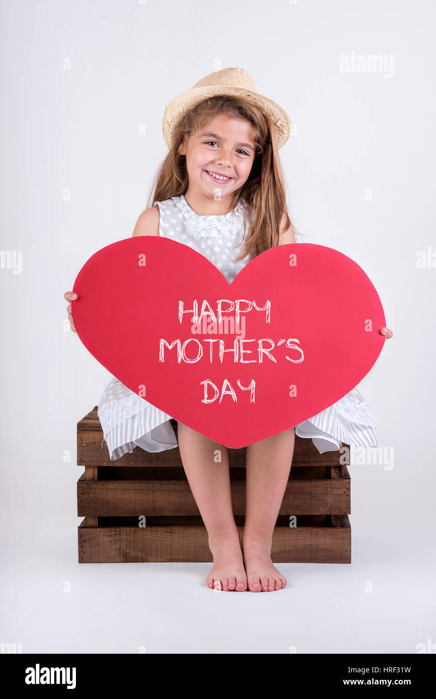 Happy Mother's Day. happy child laughing girl with heart Stock Photo ...