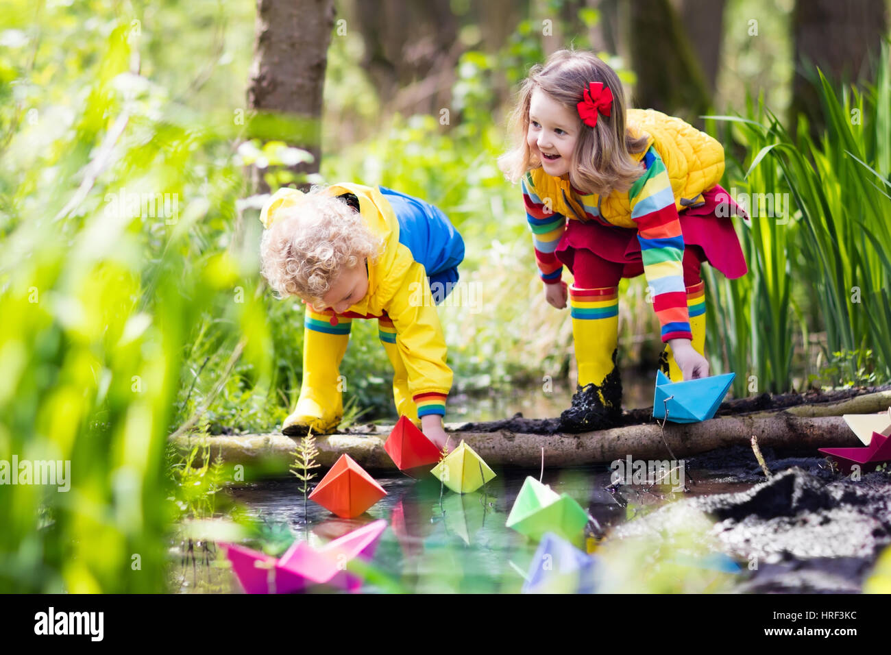 Kids playing paper boats hi-res stock photography and images - Alamy