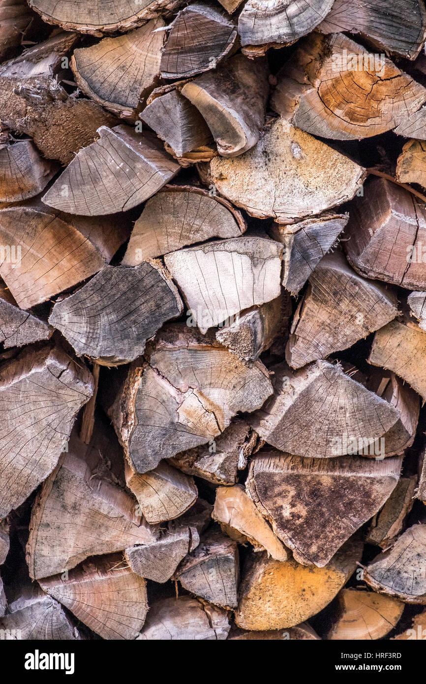 Fire wood split and stacked in a random pile Stock Photo - Alamy