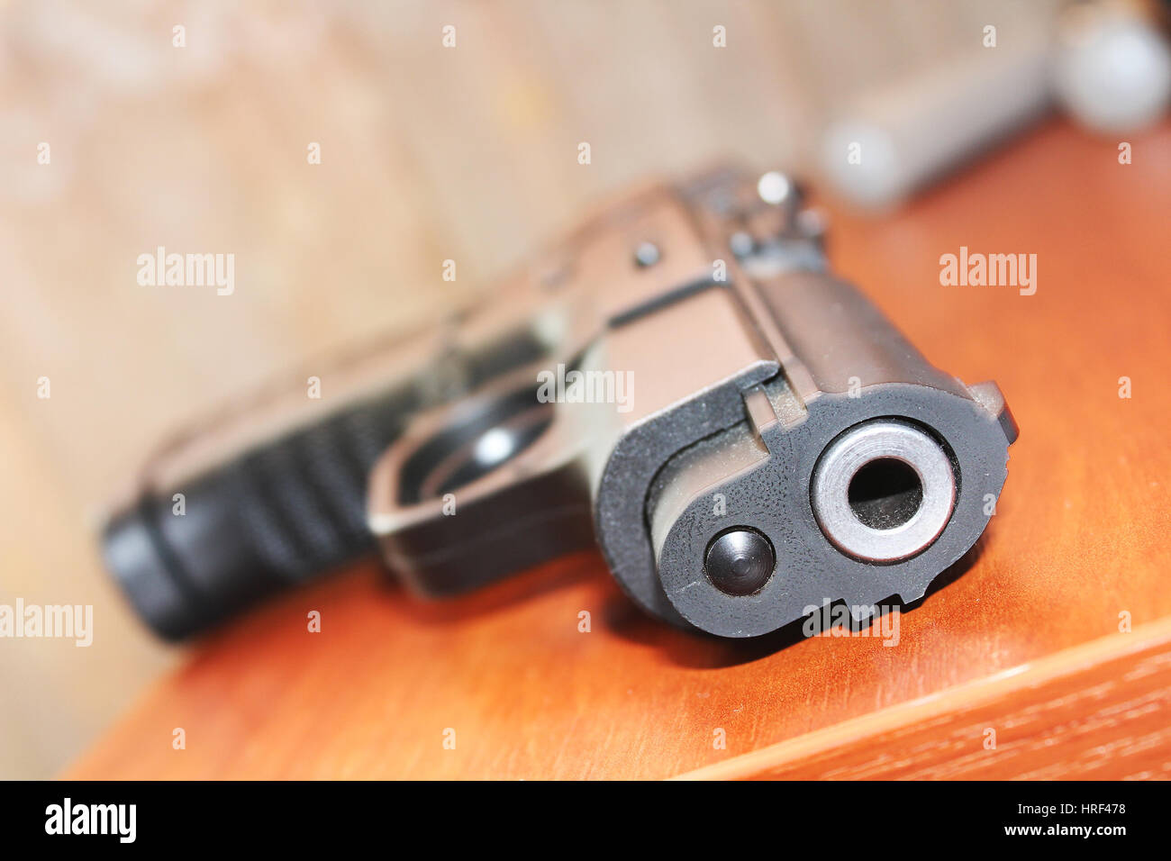 The gun lies on the table for safety Stock Photo - Alamy