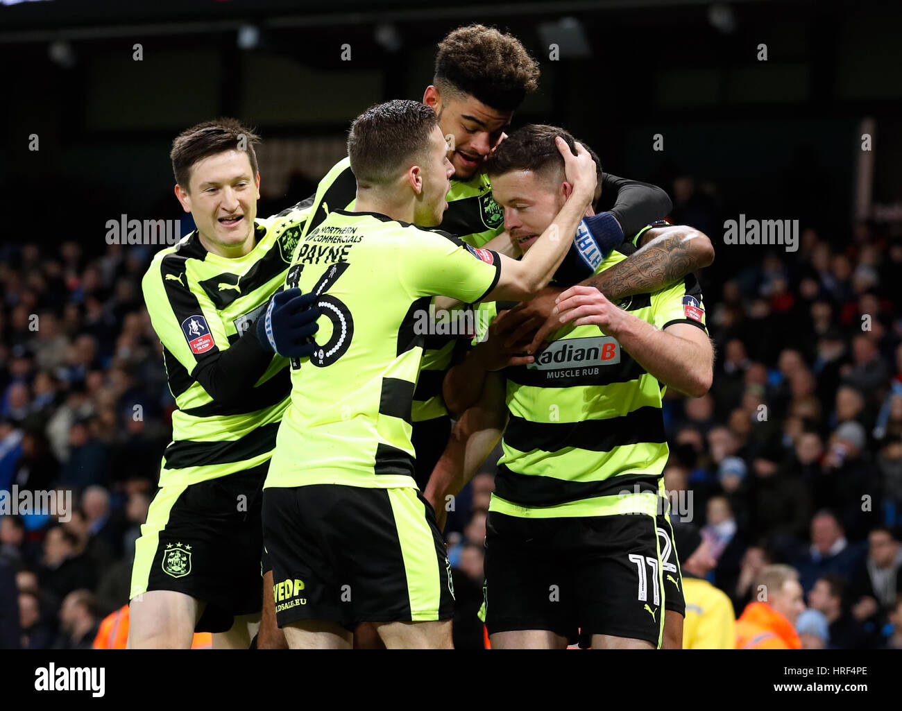 Huddersfield Town's Harry Bunn (right) celebrates scoring his side's ...